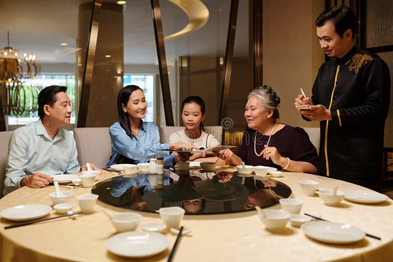 Waiter Taking Order from Family Stock Photo - Image of woman, chinese ...