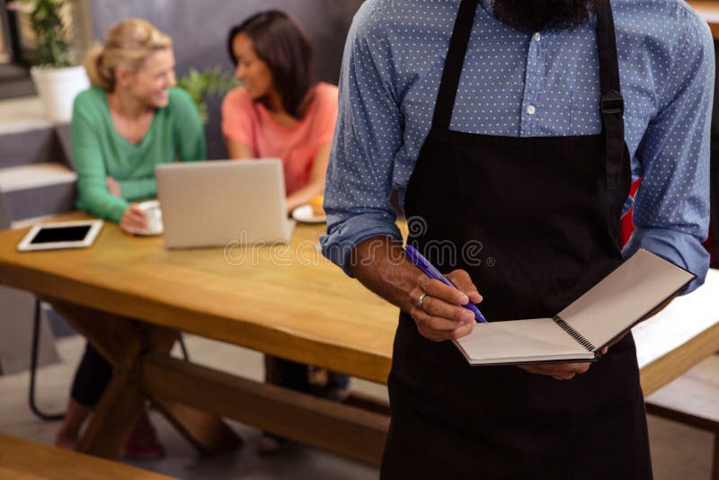 Waiter Taking Order in His Book Stock Image - Image of digital, casual ...