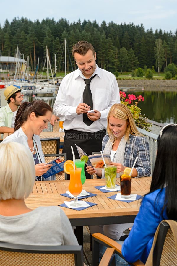 Waiter Taking Orders from Young Woman Customer Stock Image - Image of ...