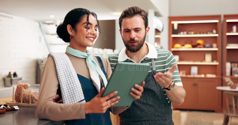 Waiter, Teamwork and Discussion with Tablet in Cafe for Workflow ...