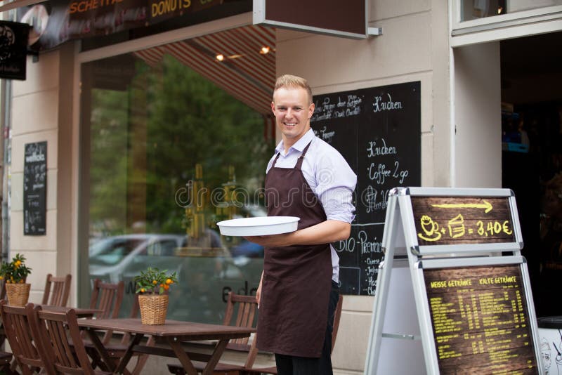 Waiter with a Tray in a Coffee Shop Stock Photo - Image of crew, cafe ...