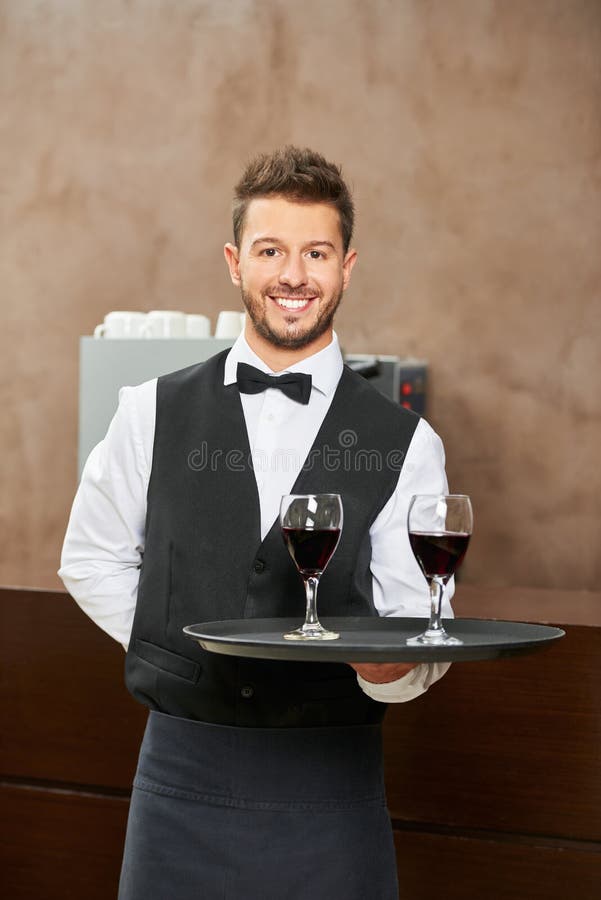 Waiter in Uniform Serving Red Wine Stock Image - Image of restaurant ...