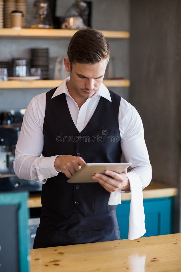 Waiter Using Digital Tablet in Restaurant Stock Image - Image of people ...