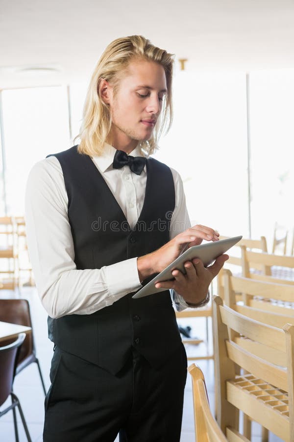 Waiter Using Digital Tablet in Restaurant Stock Image - Image of ...
