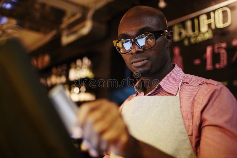 Waiter using terminal stock image. Image of occupation - 118153315