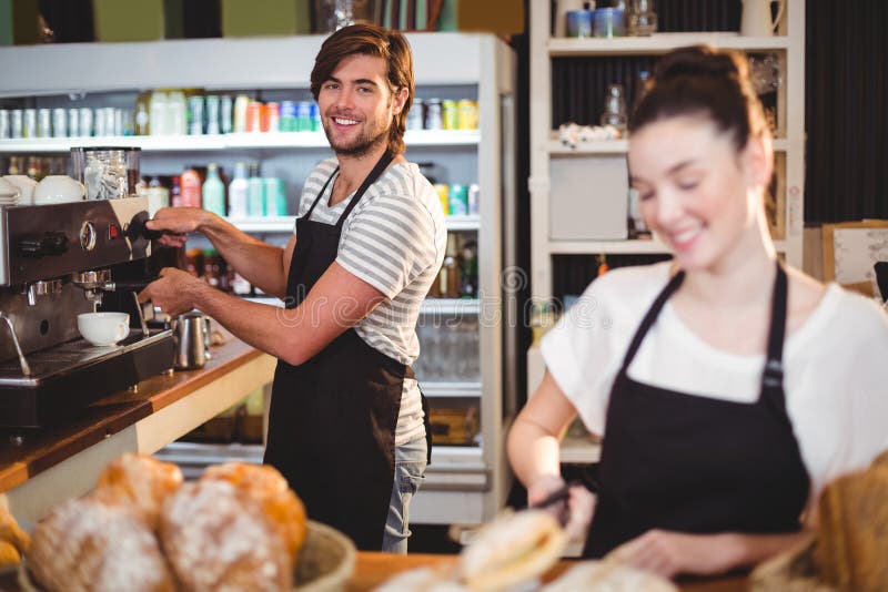 Waiter and Waitress Working Behind the Counter Stock Image - Image of ...