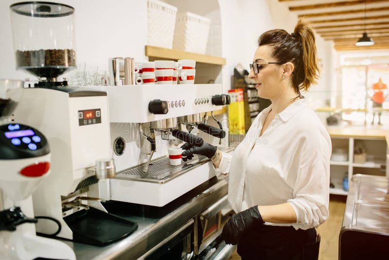 Waiter Working with a Professional Coffee Machine, Behind a Restaurant ...