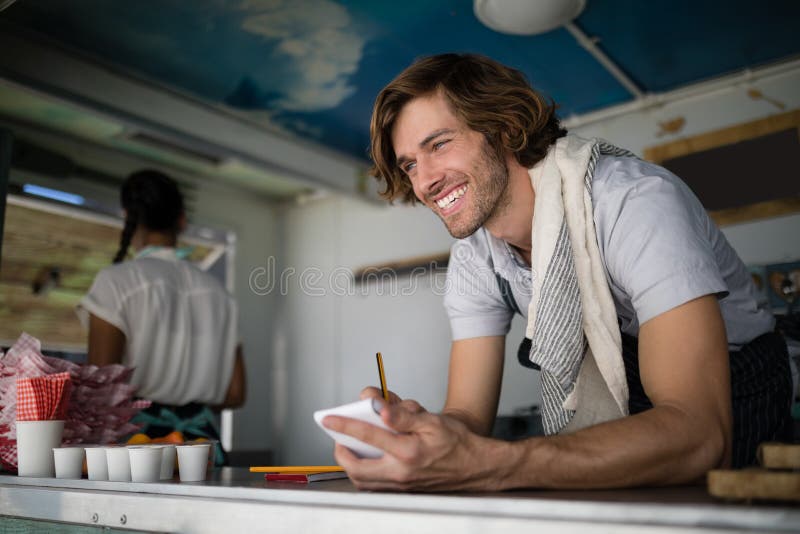 Waiter writing in notepad stock image. Image of noting - 95626193