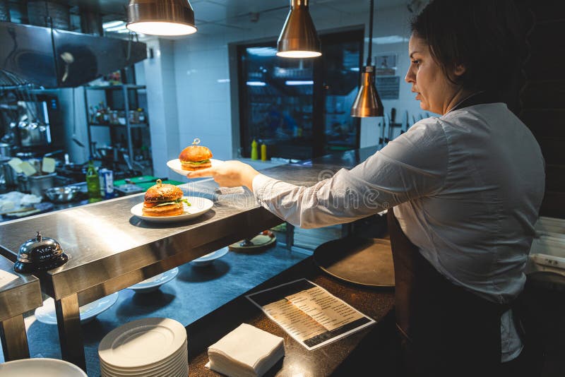 Waiters Pick Up Ready Meals in a Restaurant at the Counter for ...