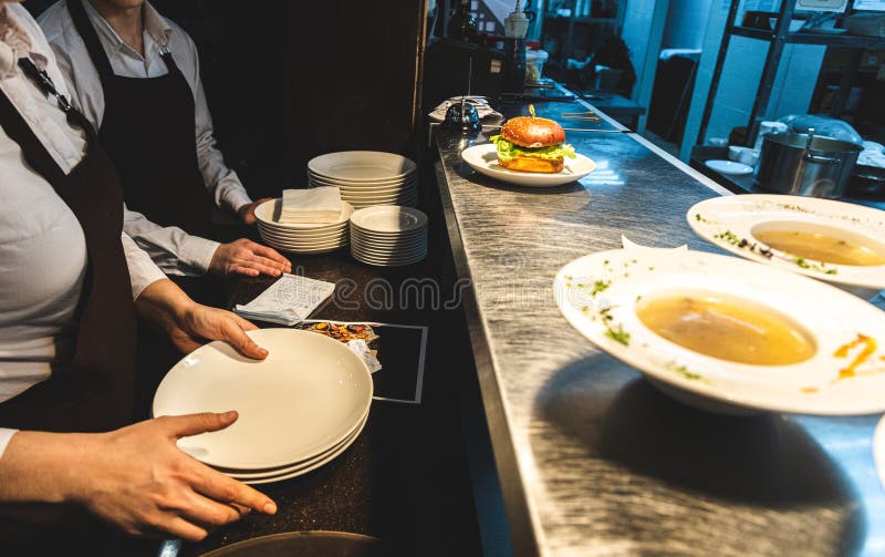 Waiters Pick Up Ready Meals in a Restaurant at the Counter for ...