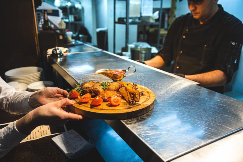Waiters Pick Up Ready Meals in a Restaurant at the Counter for ...