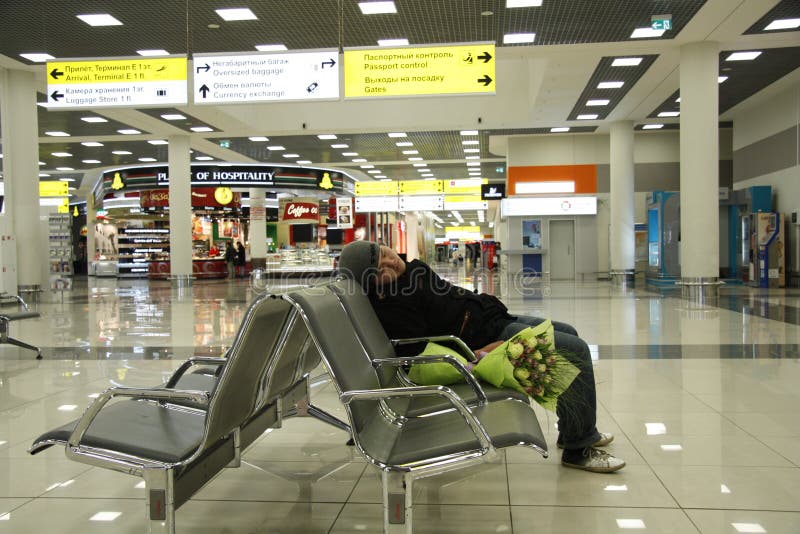 Waiting at the airport editorial stock photo. Image of bouquet - 22326113