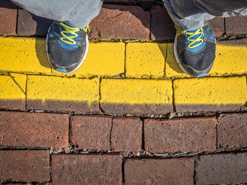 Waiting Behind a Yellow Line Stock Photo - Image of platform, abstract ...