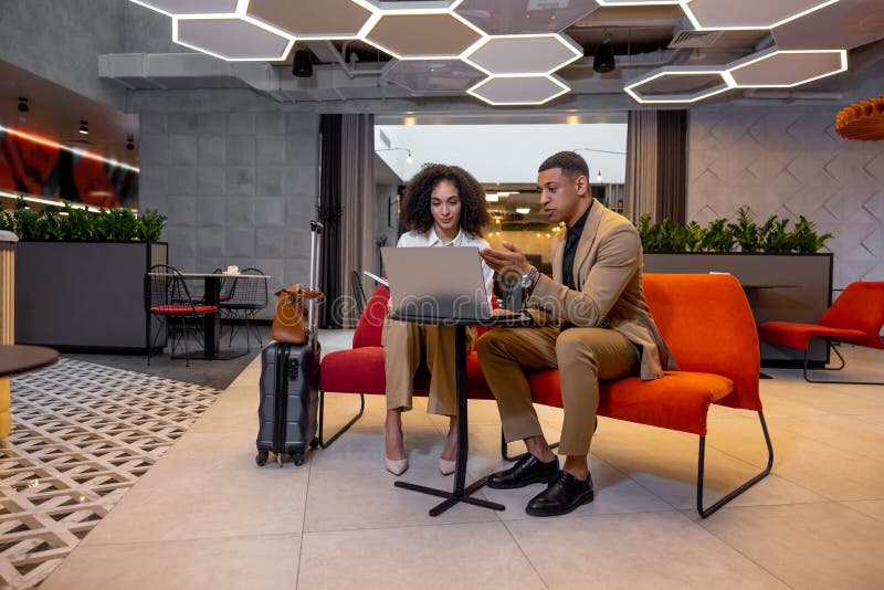 Two People Talking and Looking Involved while Waiting for the Room in ...