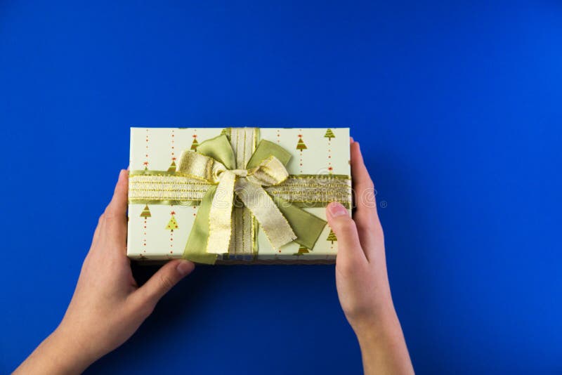 Waiting for a Gift, a Gift Box with a Bow in the Hands of a Child on a ...
