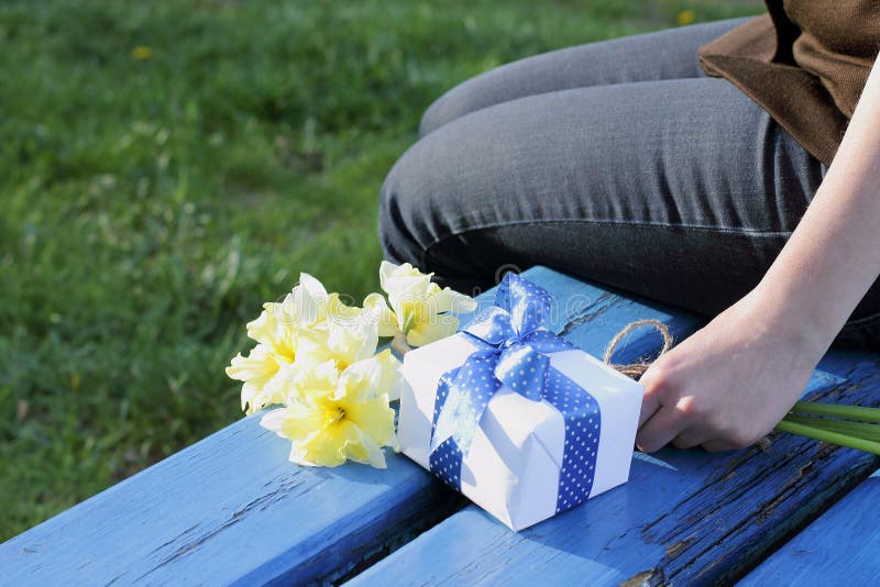 Waiting for the Meeting with a Gift and Flowers Stock Image - Image of ...