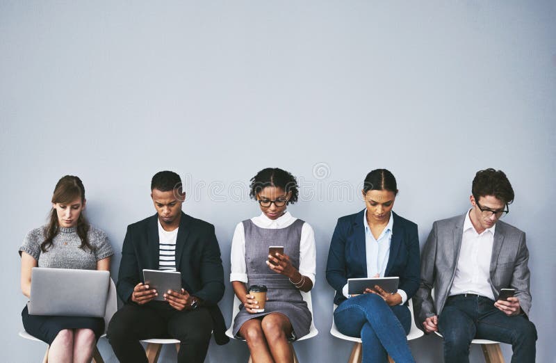 Waiting Patiently. a Group of Young Businesspeople Waiting in Line for ...