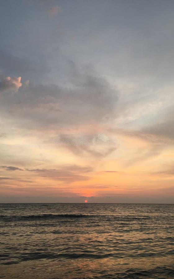 Waiting for a sunset stock image. Image of beach, wave - 209186099