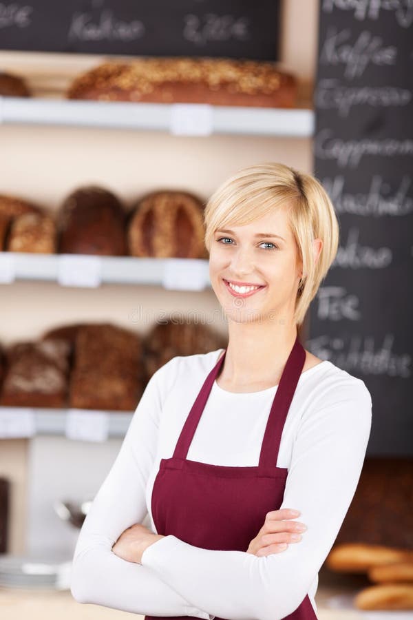 Waitress with Arms Crossed Standing in Bakery Stock Image - Image of ...