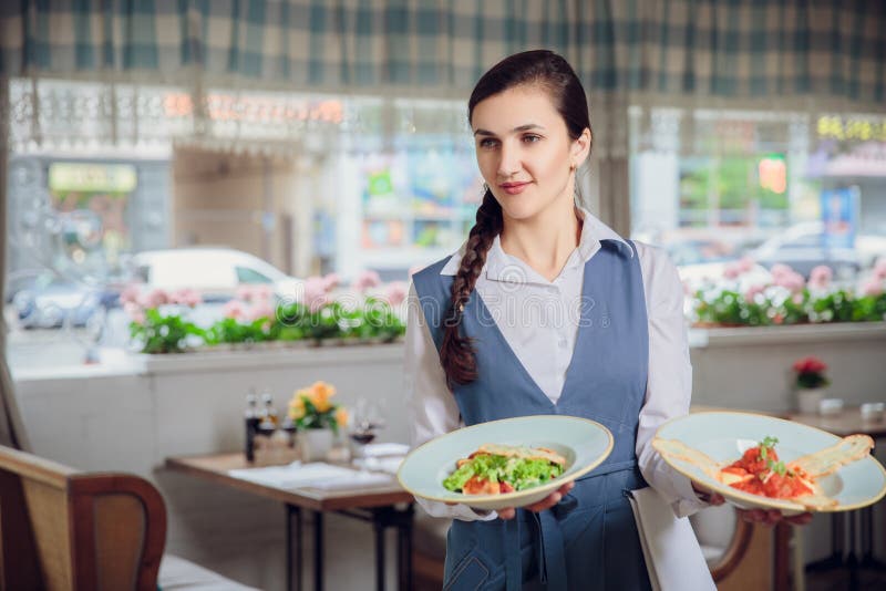 Waitress is Carrying Two Plates with Restautant Delicious Dishes Stock ...