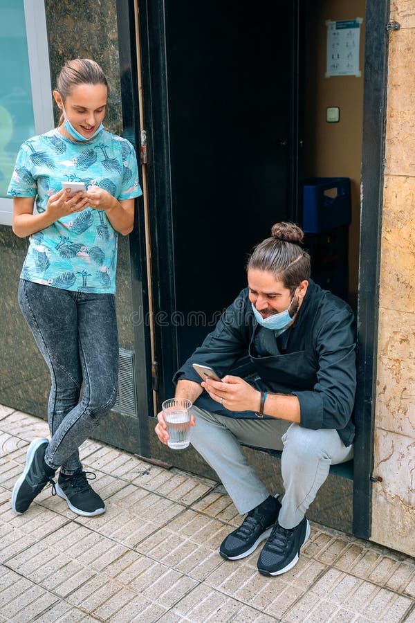 Waitress and Chef Making a Break at the Back Door Stock Photo - Image ...