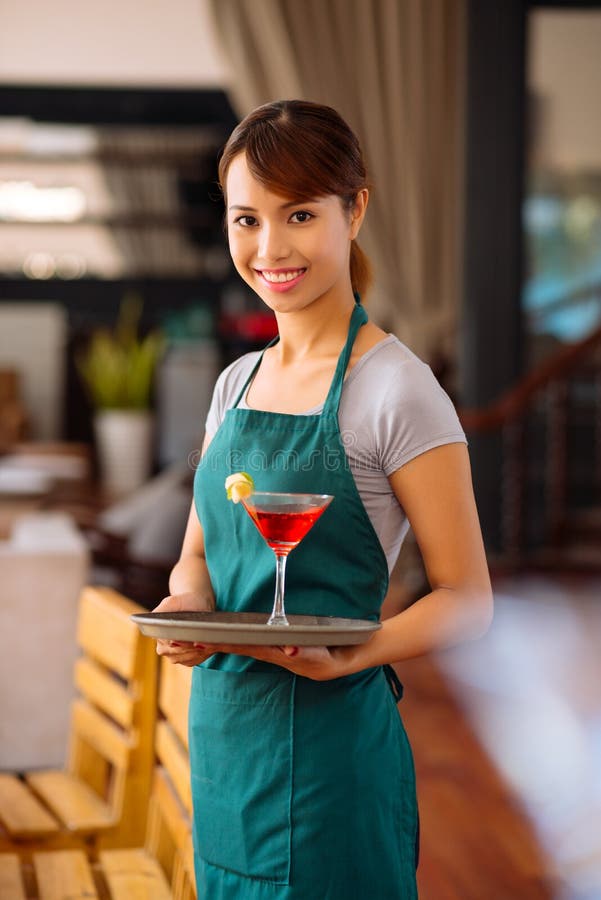 Waitress with a cocktail stock image. Image of woman - 53461267