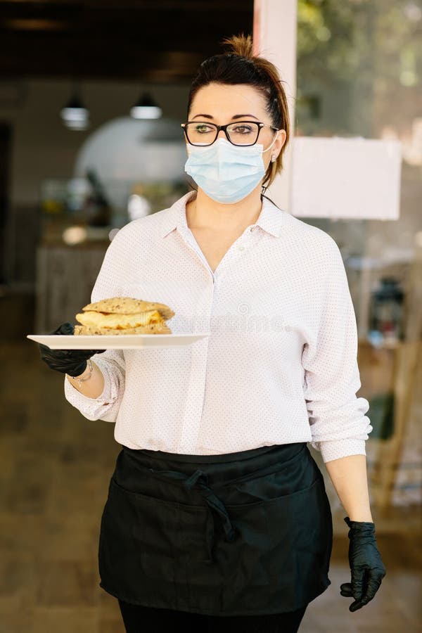 Waitress from a Bar in Spain Serves Food and Drinks To Customers on Her ...