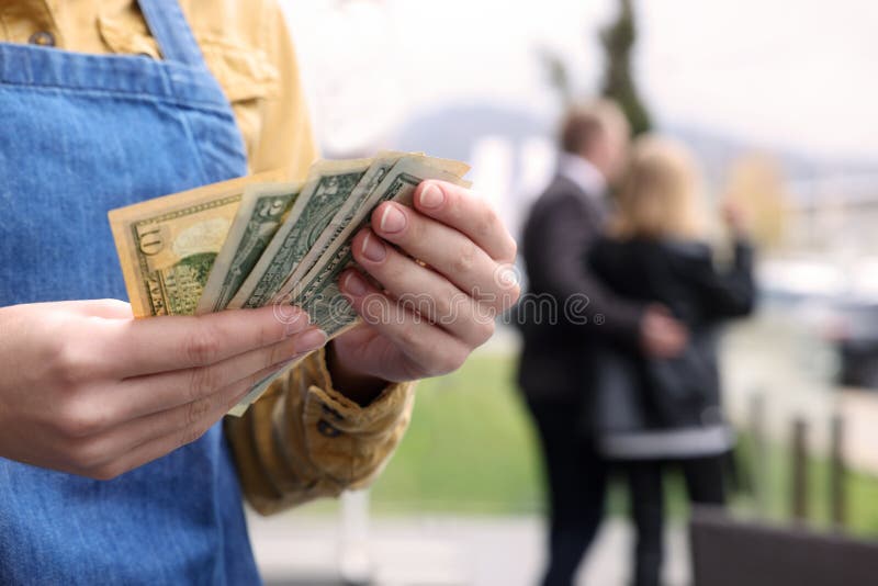 Waitress Holding Tips in Outdoor Cafe, Closeup. Space for Text Stock ...
