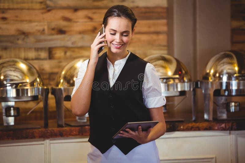 Waitress Making a Phone Call Stock Image - Image of phone, hotel: 73245993