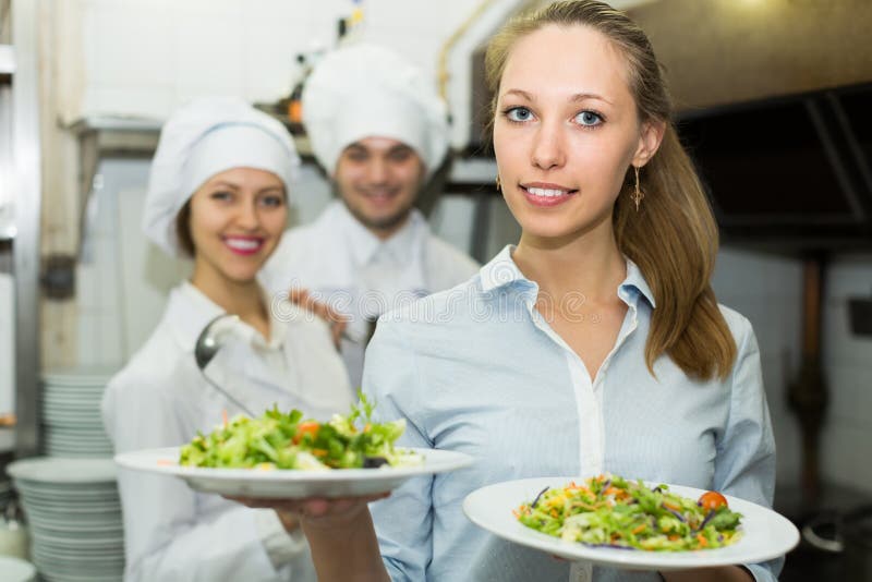 Waitress with Plates at Kitchen Stock Image - Image of person, cooking ...