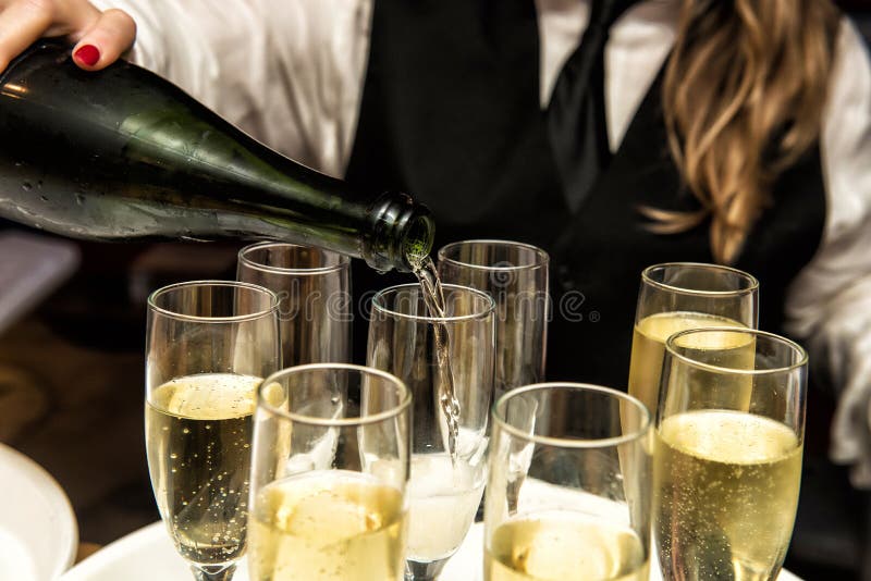 Waitress Filling Champagne Glass Stock Image - Image of restaurant ...