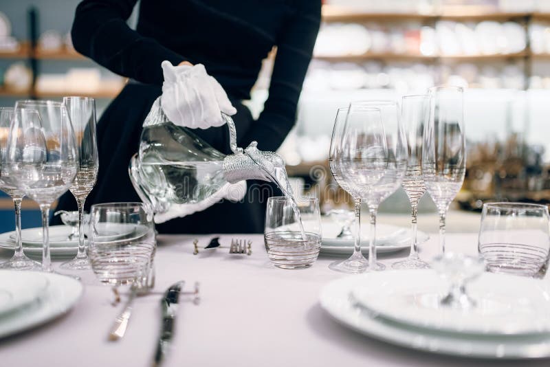 Waitress Pours Drinks into Glasses, Table Setting Stock Image - Image ...