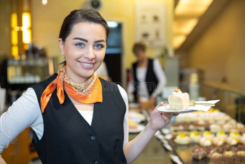 Waitress Presenting the Menu To a Guest in Restaurant Stock Image ...