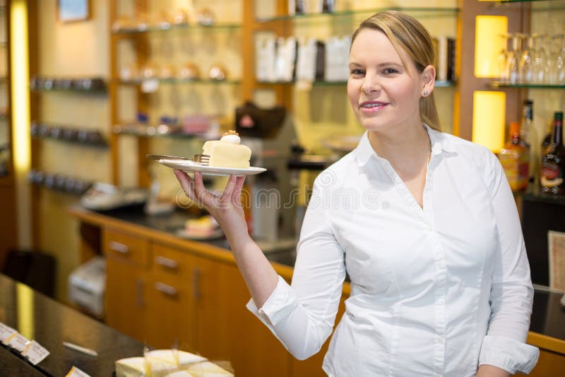 Waitress Presenting the Menu To a Guest in Restaurant Stock Image ...