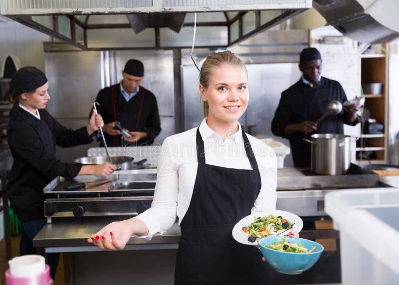 Waitress in Restaurant Kitchen with Ordered Meals Stock Image - Image ...