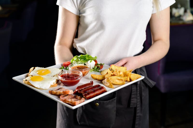 Waitress Serving Breakfast at a Restaurant Stock Photo - Image of party ...