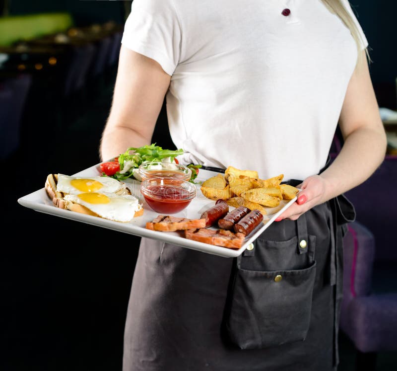 Waitress Serving Breakfast at a Restaurant Stock Image - Image of hand ...
