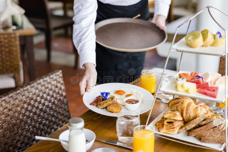 Waitress Serving Breakfast at a Restaurant Stock Photo - Image of ...