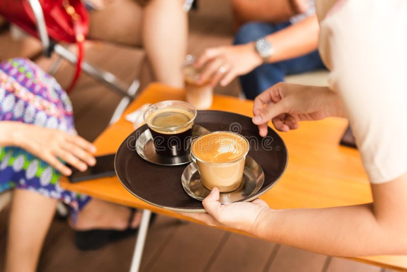 Waitress Serving Customer a Hot Coffee at Cafe. Stock Photo - Image of ...