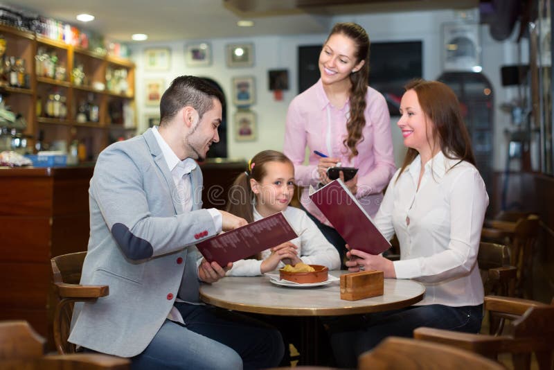 Waitress Serving Family of Three Stock Photo - Image of respectful ...