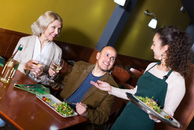 Waitress Serving Senior Customers . Stock Image - Image of people ...