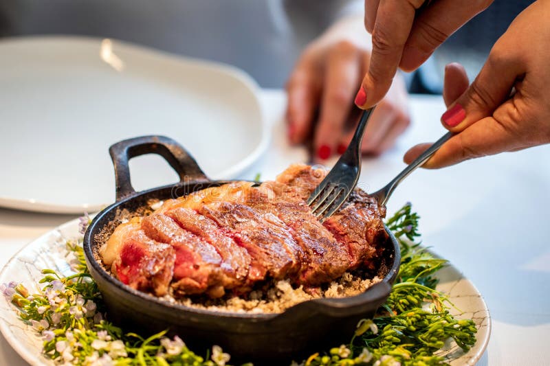 Waitress Serving Steak at Table in Restaurant Stock Image - Image of ...