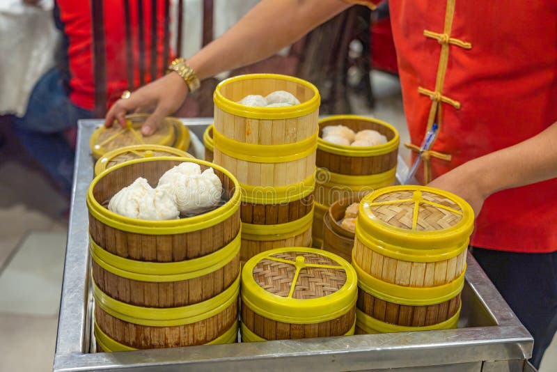 Waitress Serving Steamed Dimsum on the Cart in Chinese Restaurant Stock ...