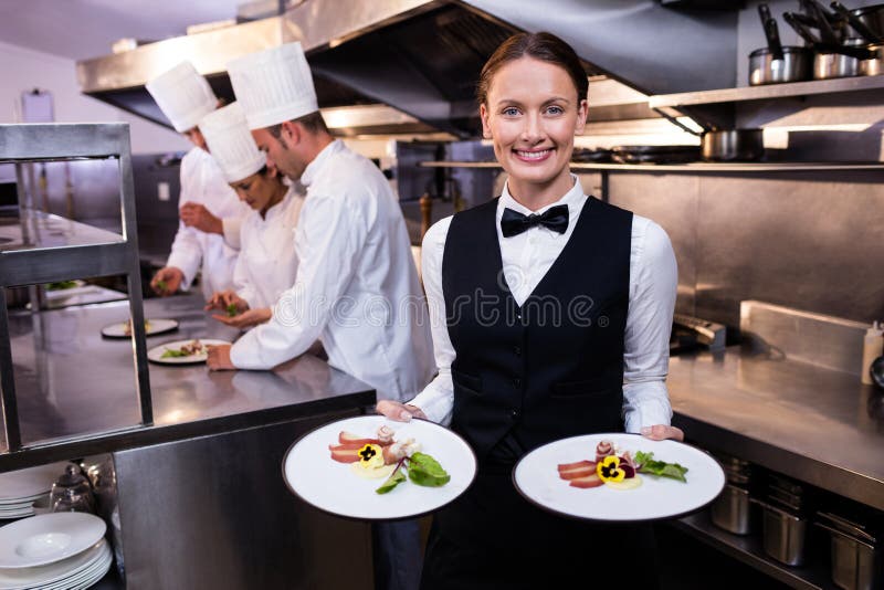 Waitress Showing Dishes To the Camera Stock Photo - Image of indoors ...