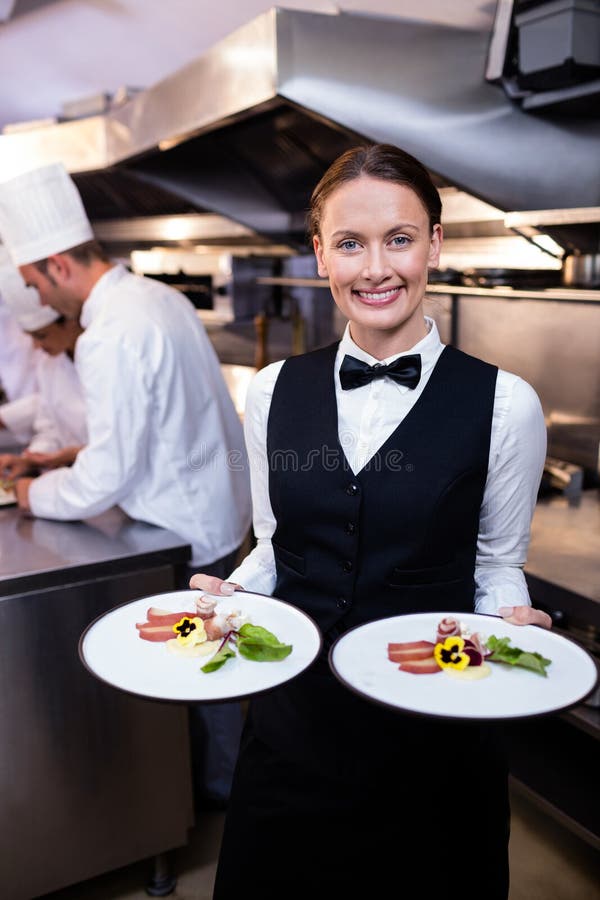 Waitress Showing Dishes To the Camera Stock Image - Image of food ...