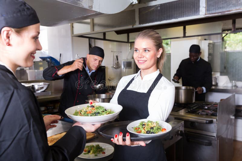 Waitress Taking Cooked Meals in Kitchen Stock Image - Image of dishes ...