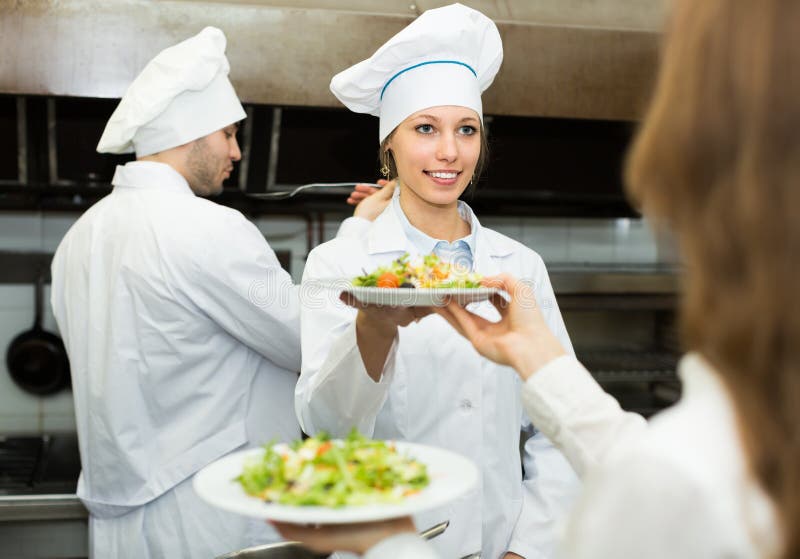 Waitress Taking Dish from Kitchen Stock Image - Image of bistro, plate ...