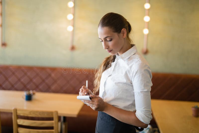 Waitress Taking an Order on Notepad Stock Photo - Image of drink ...