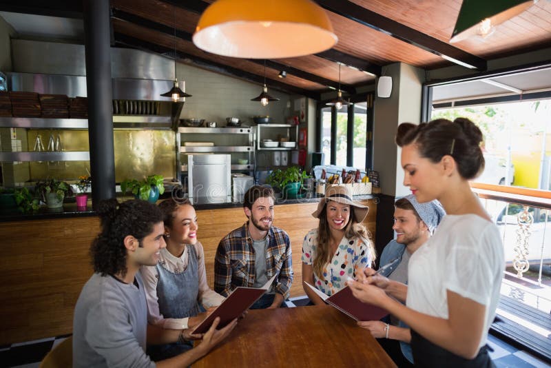 Waitress Taking Orders from Customers in Restaurant Stock Image - Image ...