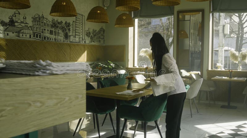 Waitress in Uniform Sets the Tables in Cafe Stock Photo - Image of ...
